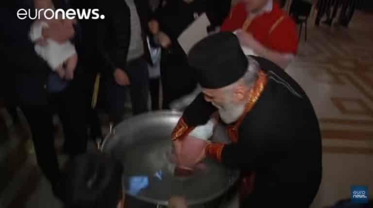 Priest Dunking Child in Controversial Hazing-Like Baptism Sparks Online ...