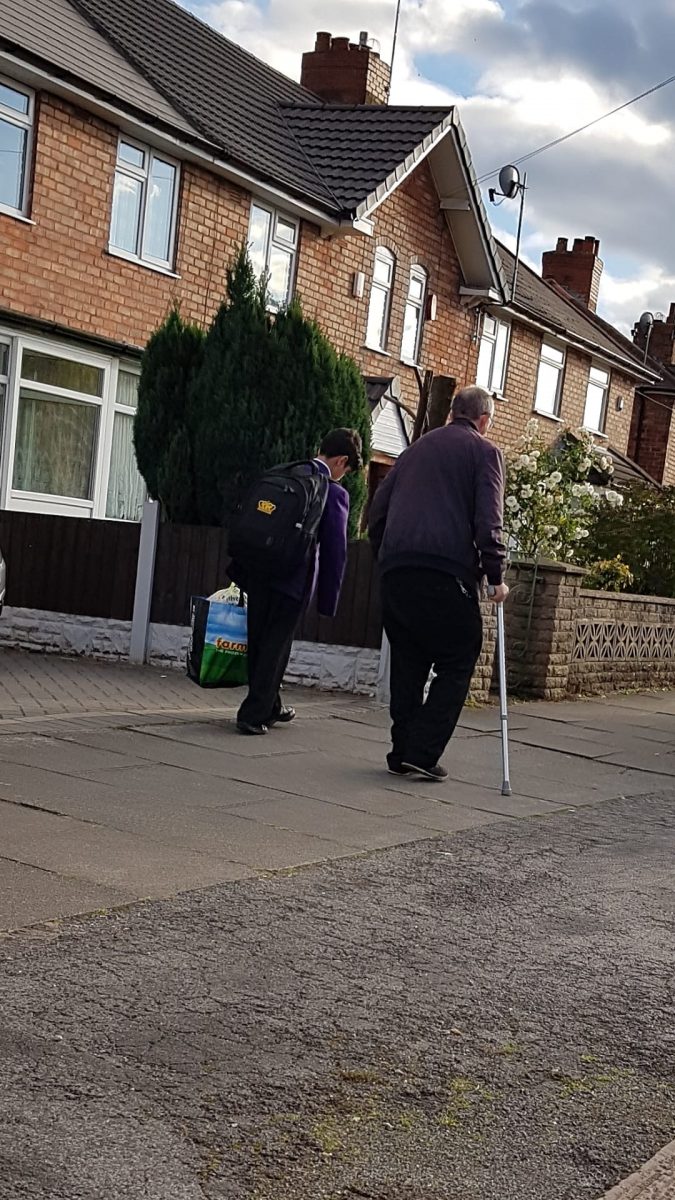 Viral Photo Captures Young Boy Volunteering To Carry Elderly Man’s Bag ...